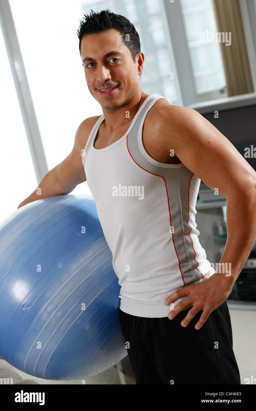 Fit guy working out at home Stock Photo - Alamy