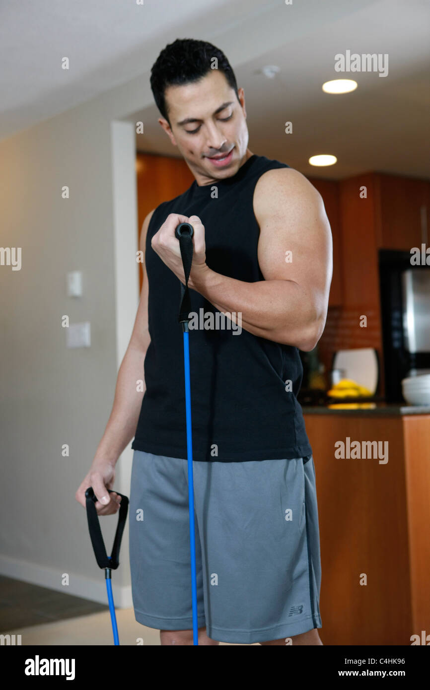 Fit guy working out at home Stock Photo - Alamy