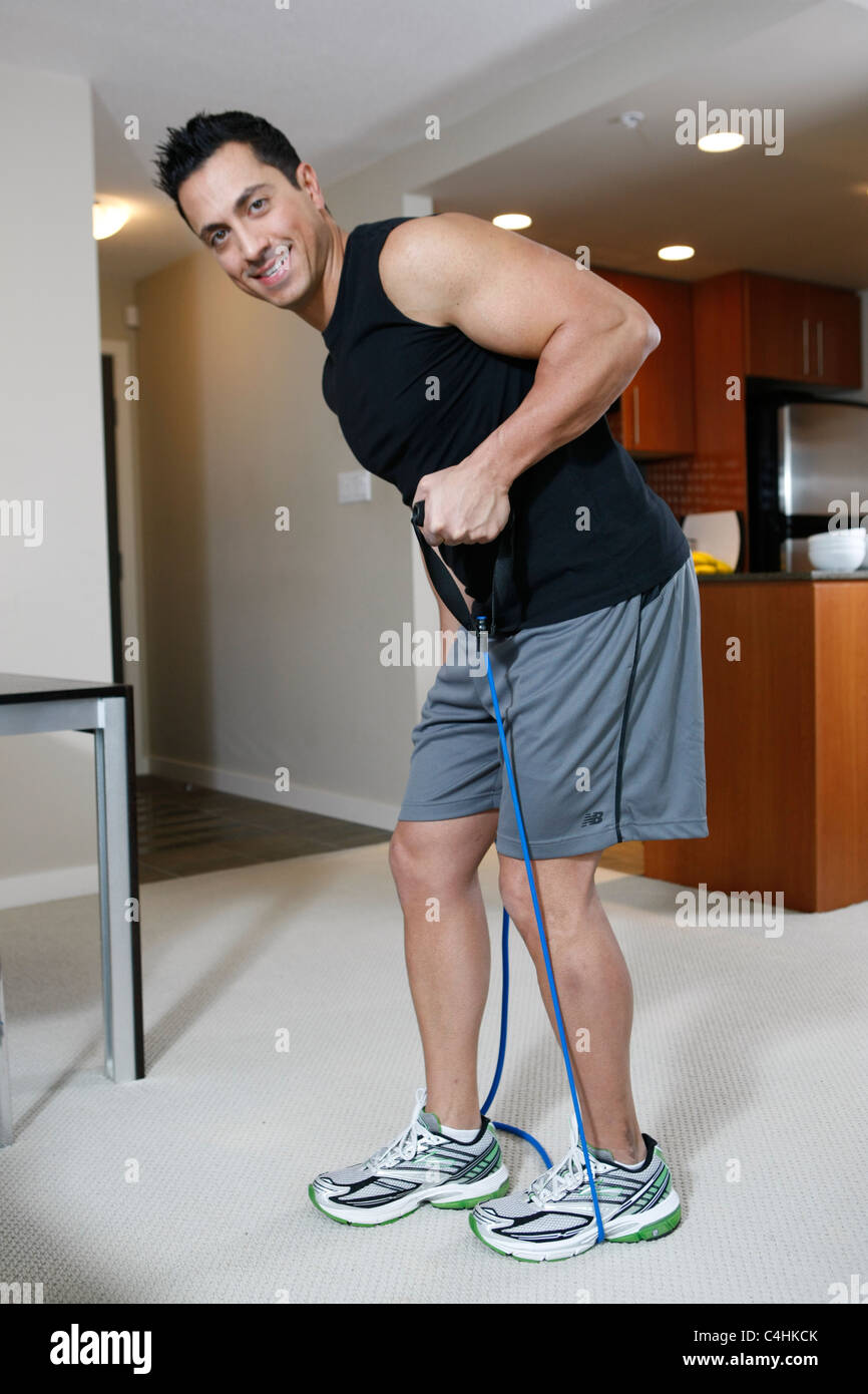 Fit guy working out at home Stock Photo - Alamy