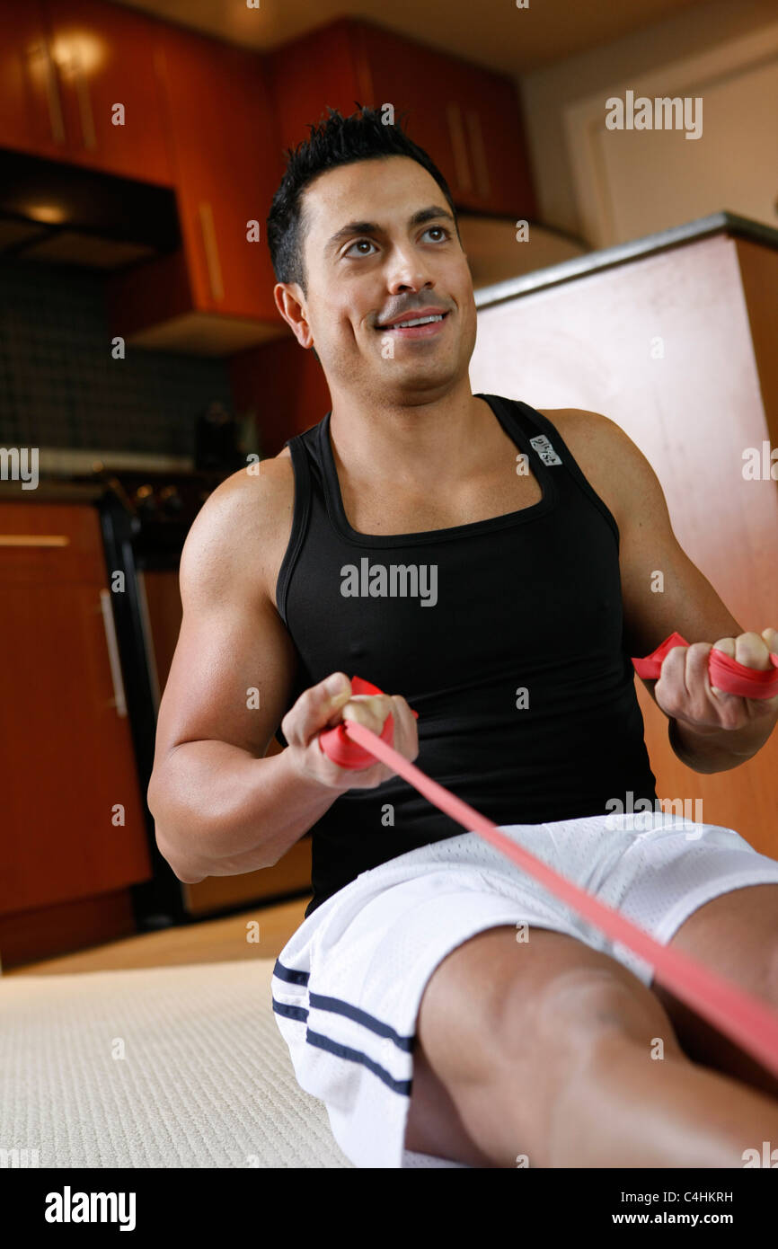 Fit guy working out at home Stock Photo - Alamy