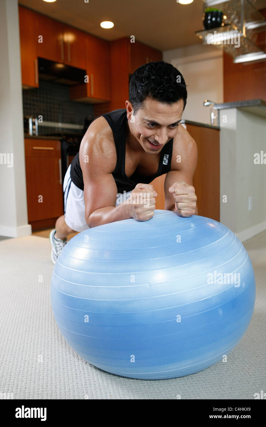 Fit guy working out at home Stock Photo - Alamy
