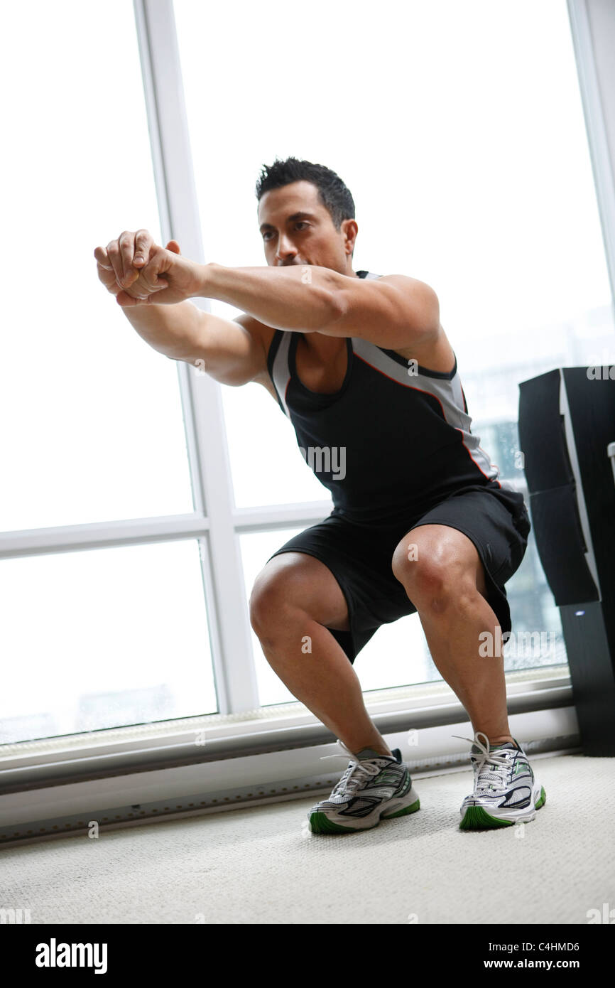 Fit guy working out at home Stock Photo - Alamy