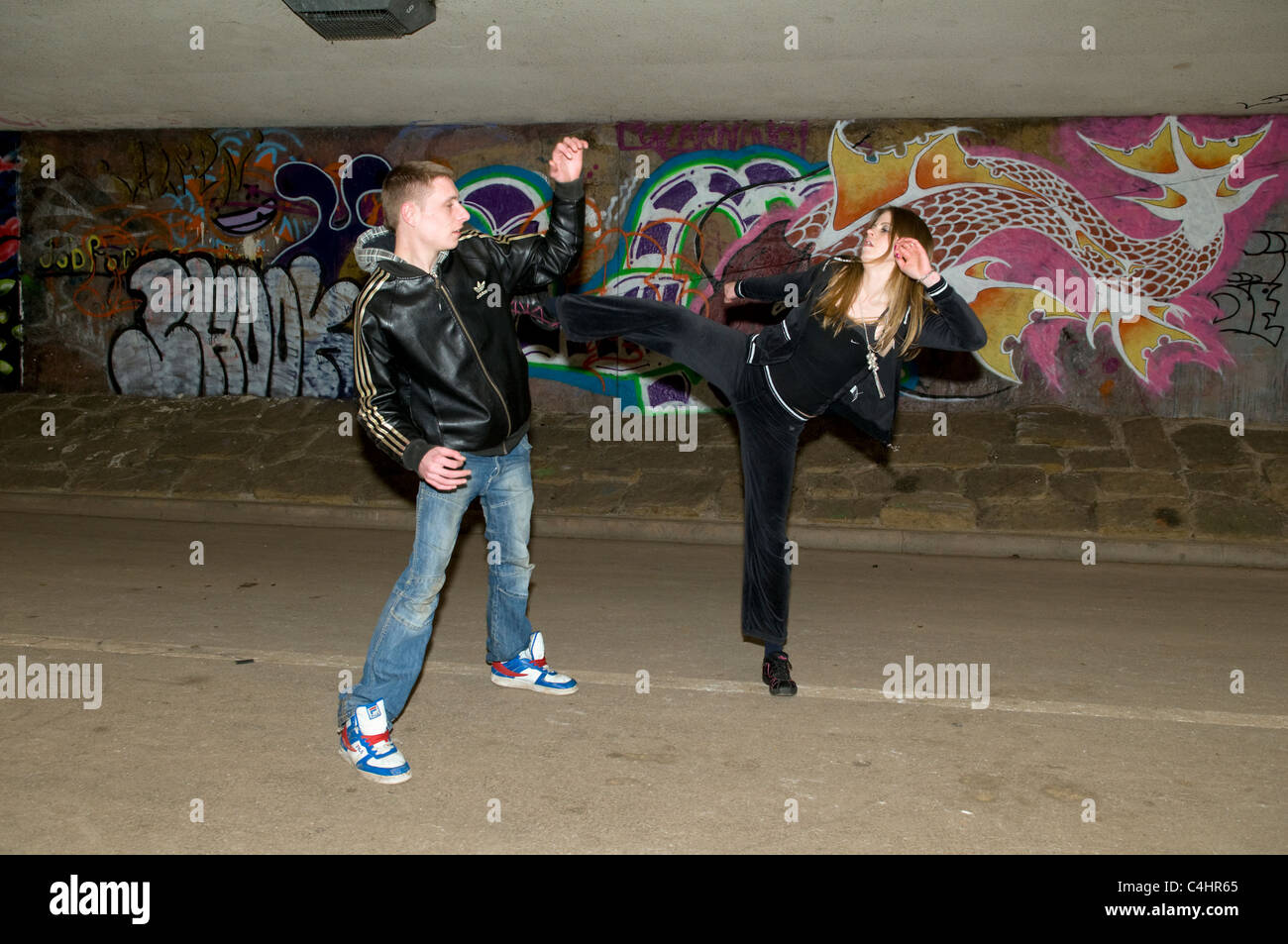 Scene showing young Caucasian woman defending herself with tae kwon ...