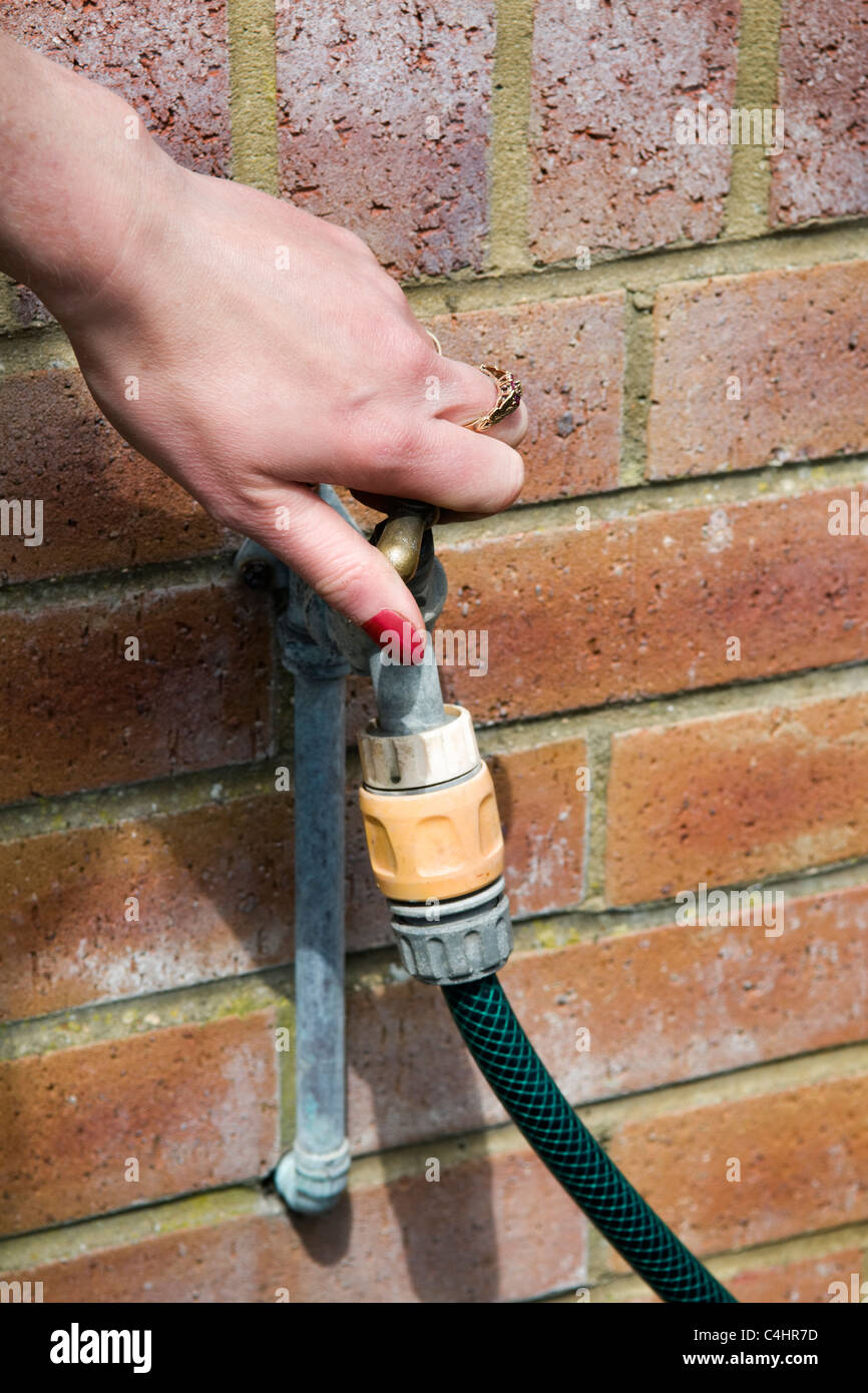 Hand and tap hi-res stock photography and images - Alamy