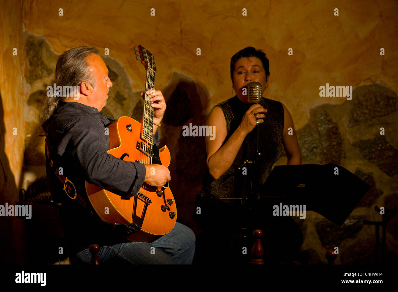 Classic jazz duet performing with stage lighting Stock Photo - Alamy