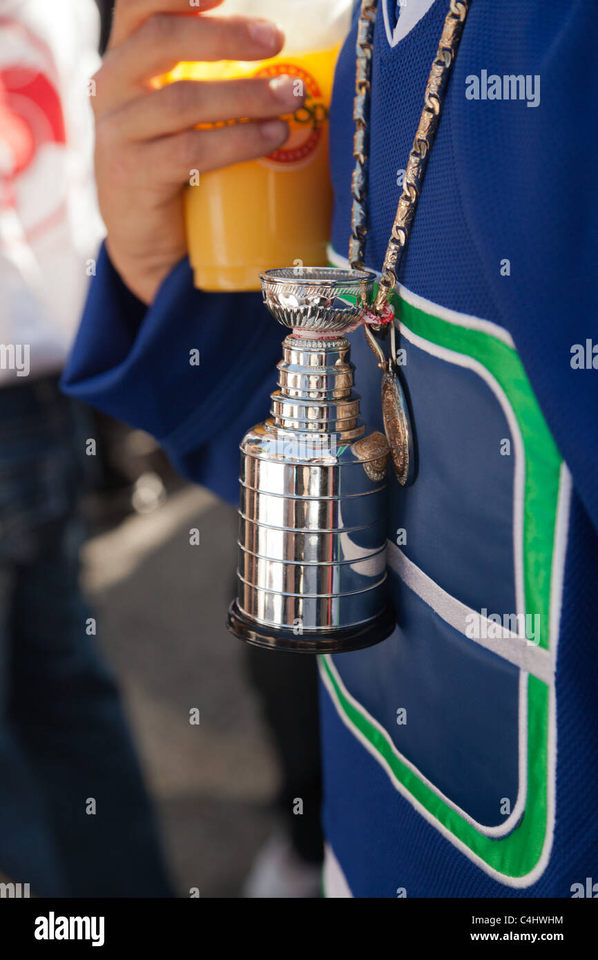 Vancouver Canucks hockey fan with miniature Stanley Cup medallion at ...