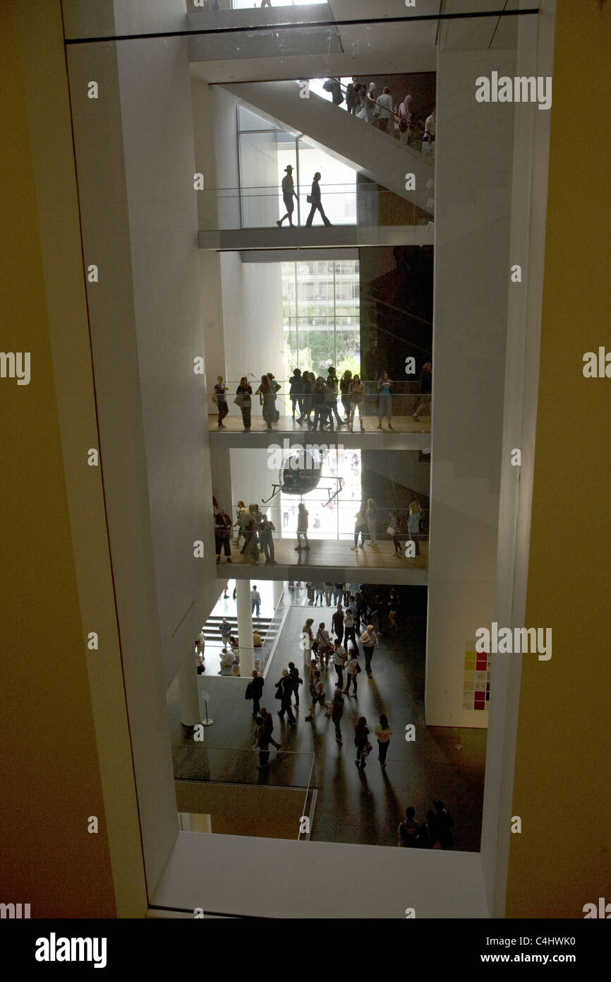 Visitors at The Museum Of Modern Art (MOMA) can be seen on all floors ...