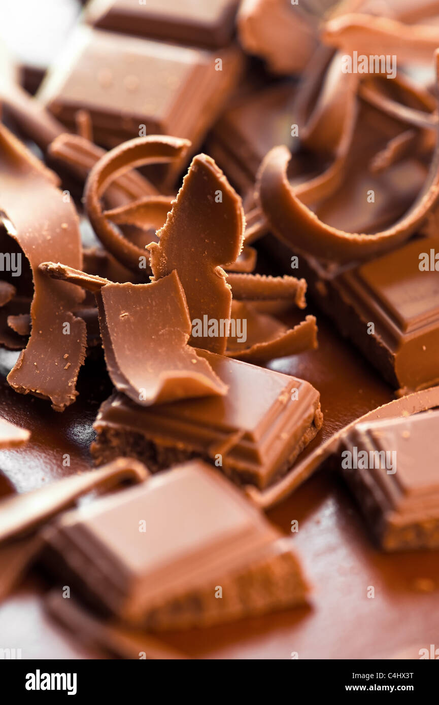 Chocolate background. Bars and strips of chocolate. Shallow depth of ...