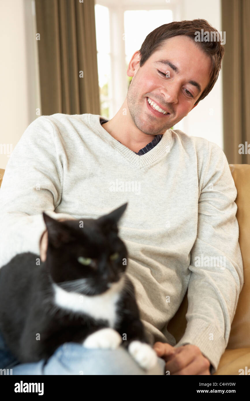 Man cat on lap sitting hi-res stock photography and images - Alamy
