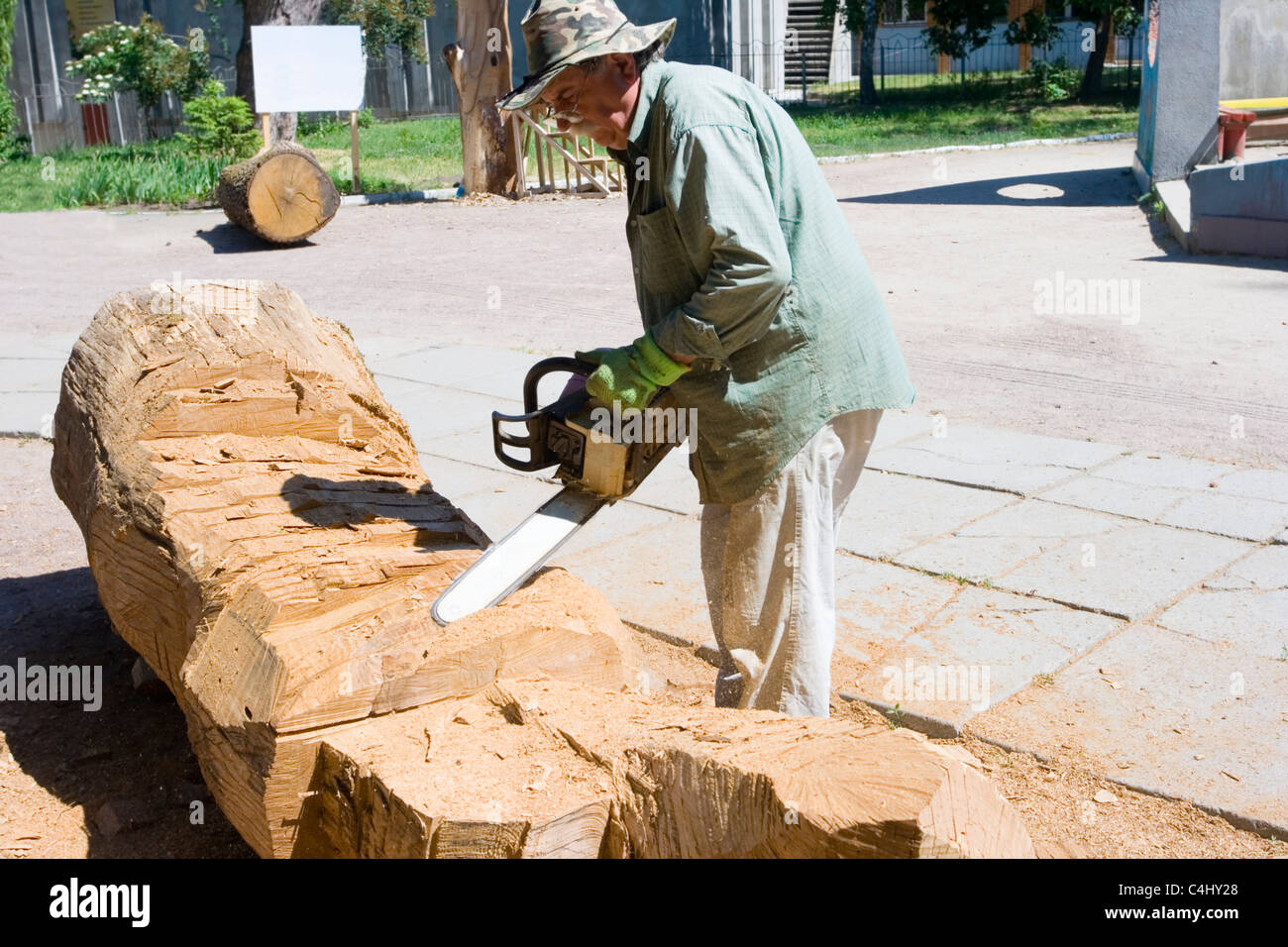 A sculptor creates a wooden sculpture Stock Photo - Alamy
