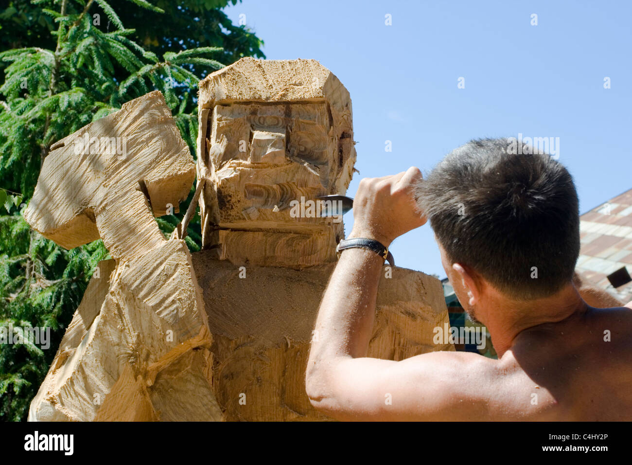 A sculptor creates a wooden sculpture Stock Photo - Alamy