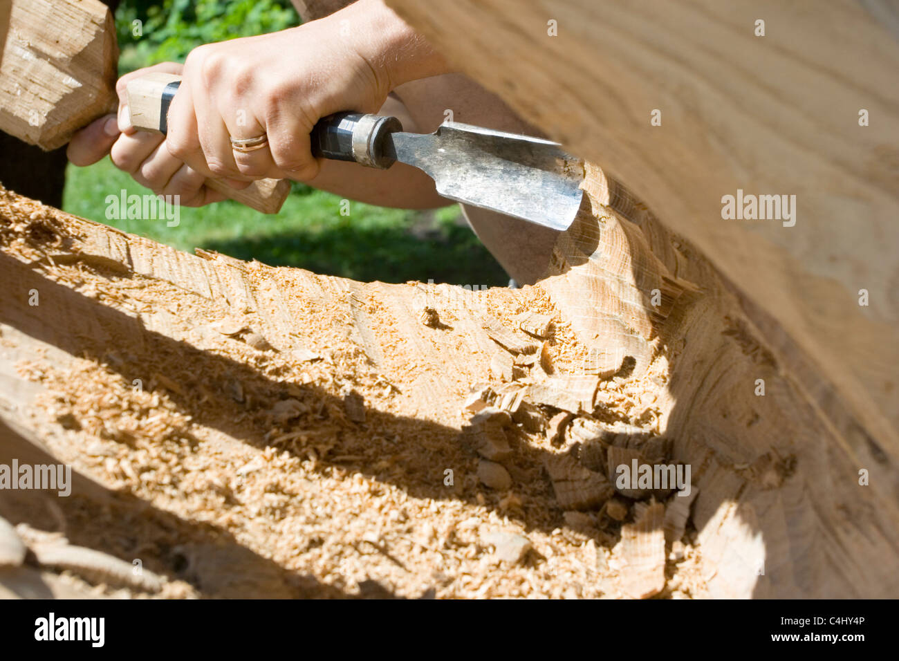 A sculptor creates a wooden sculpture Stock Photo - Alamy
