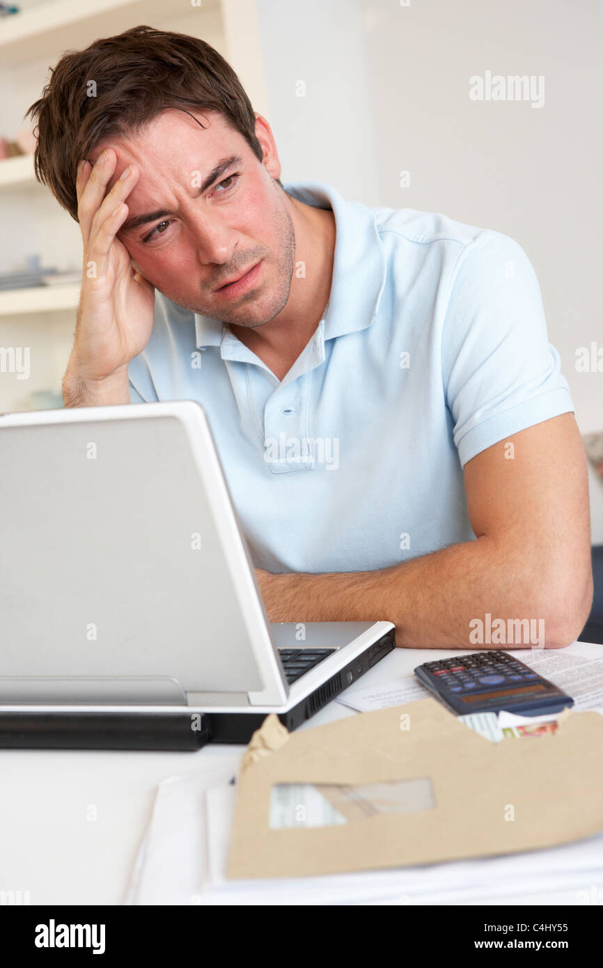 Young man working with laptop computer Stock Photo - Alamy