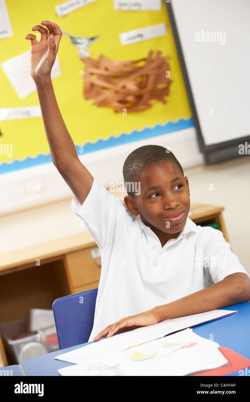 Student answering a question in classroom hi-res stock photography and ...