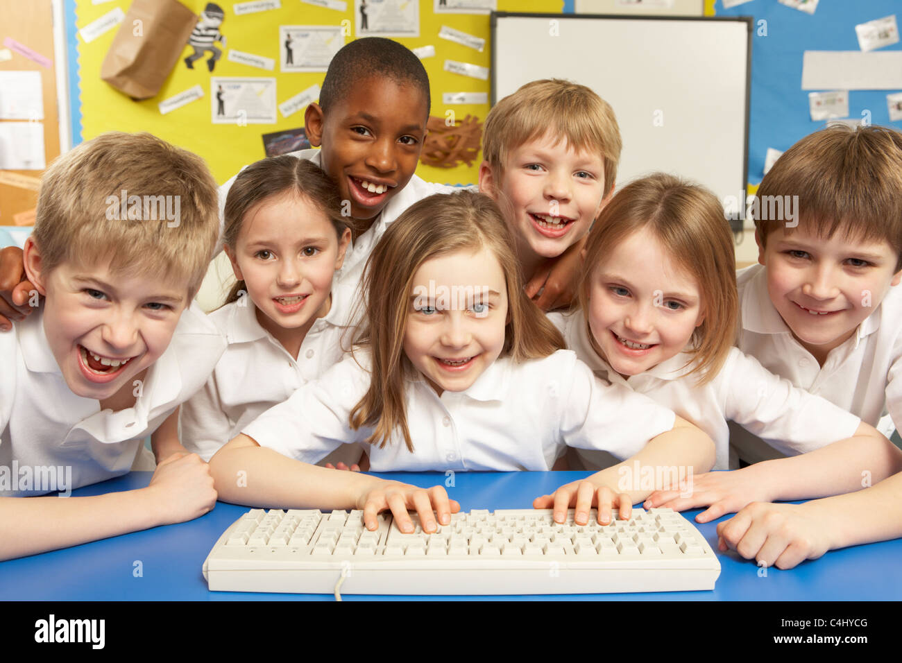 Schoolchildren in IT Class Using Computers Stock Photo - Alamy