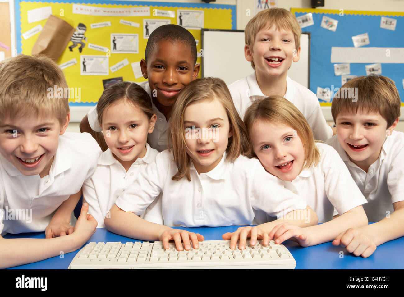 Schoolchildren in IT Class Using Computers Stock Photo - Alamy