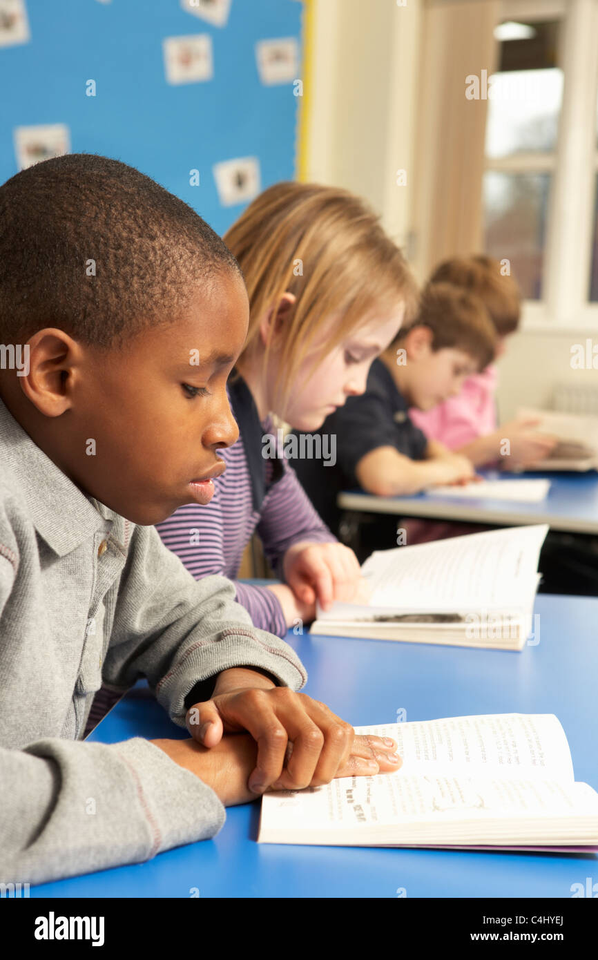 Schoolboy reading to class uniform hi-res stock photography and images ...