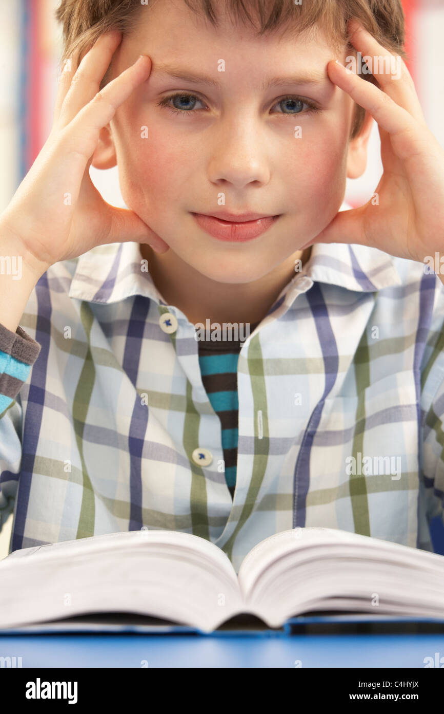 Stressed Schoolboy Studying In Classroom Stock Photo - Alamy Stressed Schoolboy Studying In Classroom Stock Photo - Alamy
