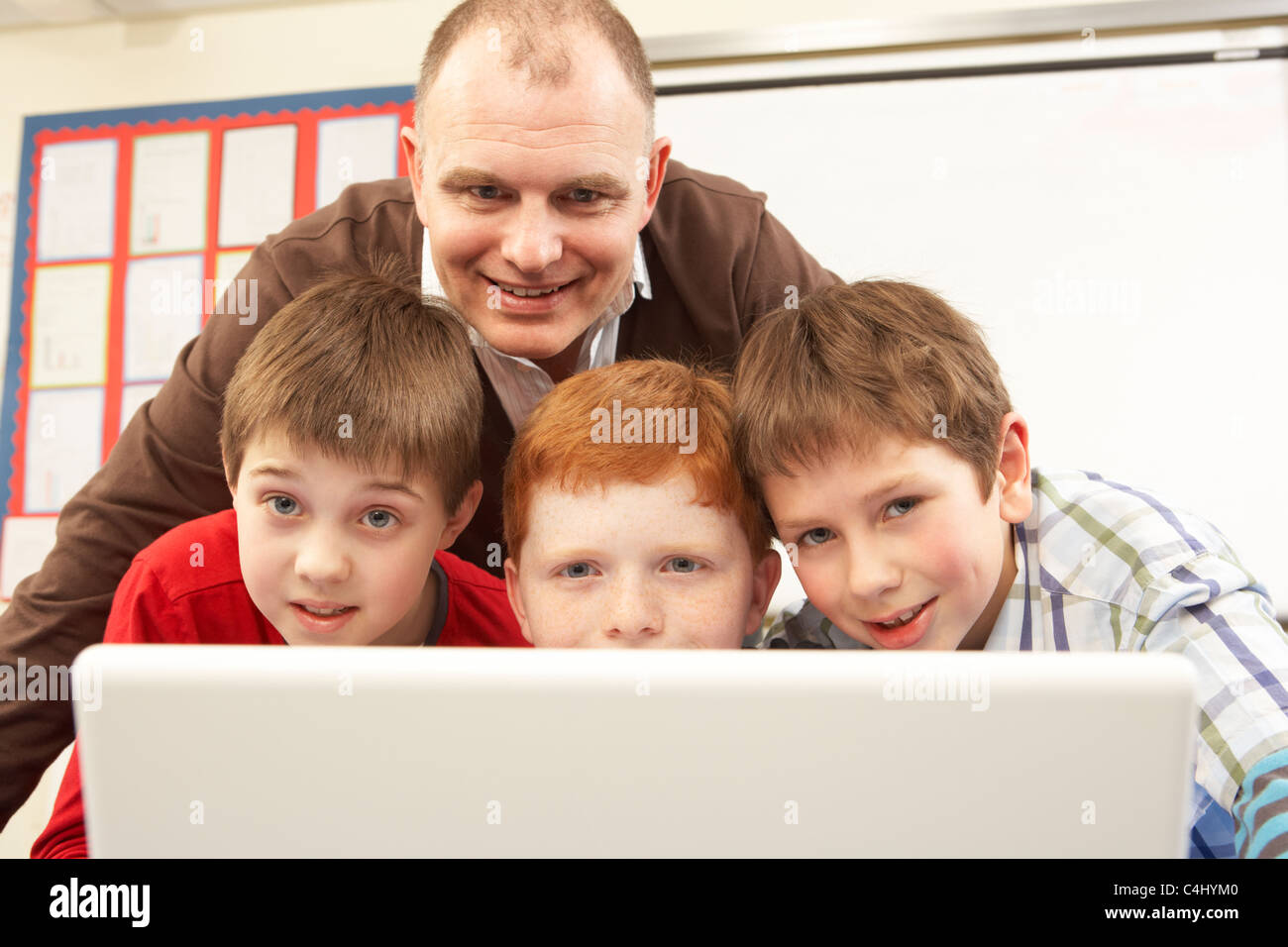 Group Of Schoolboys In IT Class Using Computer Stock Photo - Alamy