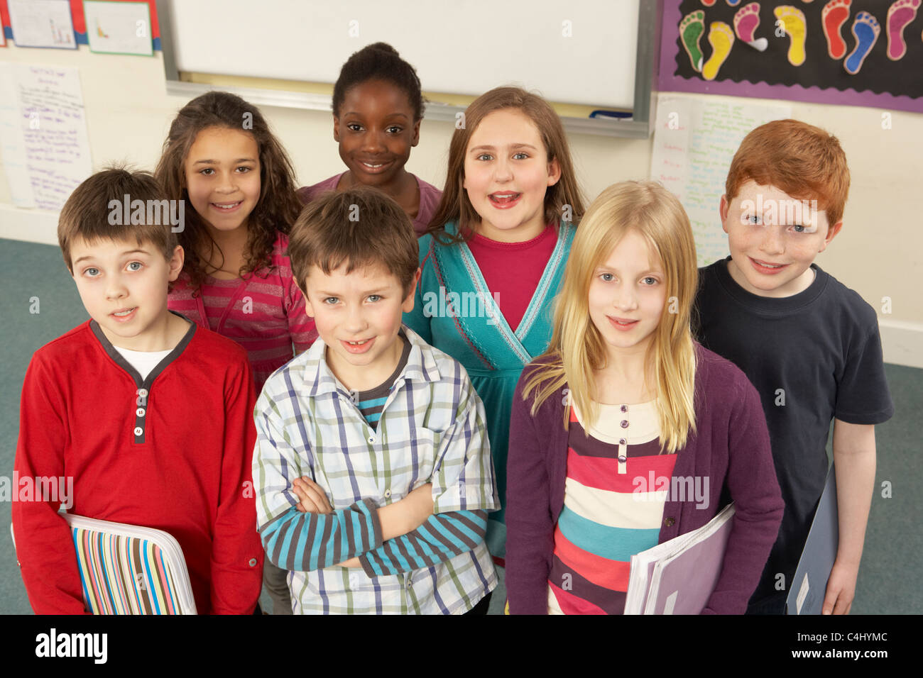 Portrait Of Schoolchildren Standing In Classroom Stock Photo - Alamy