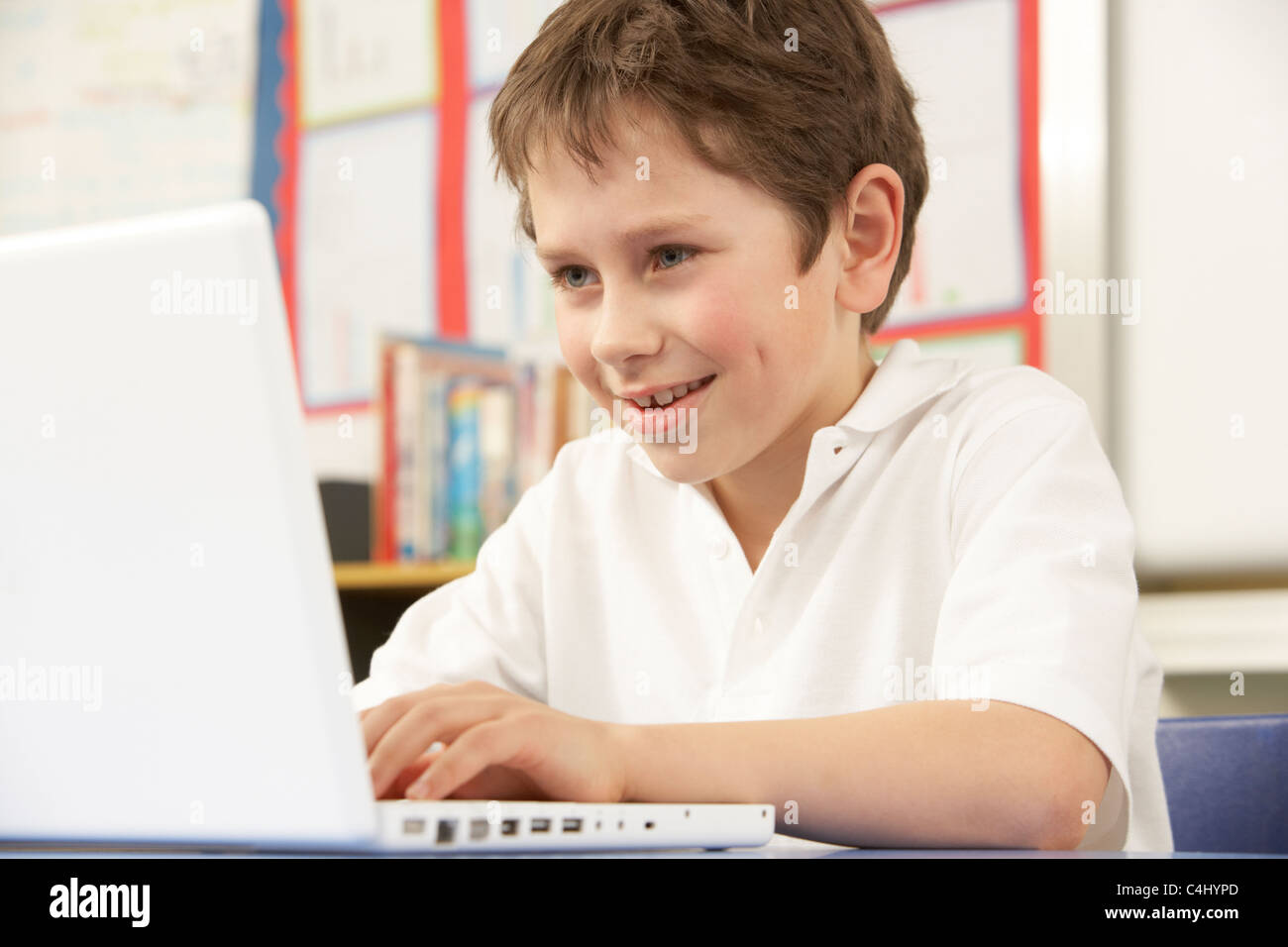 Schoolboy In IT Class Using Computer Stock Photo - Alamy