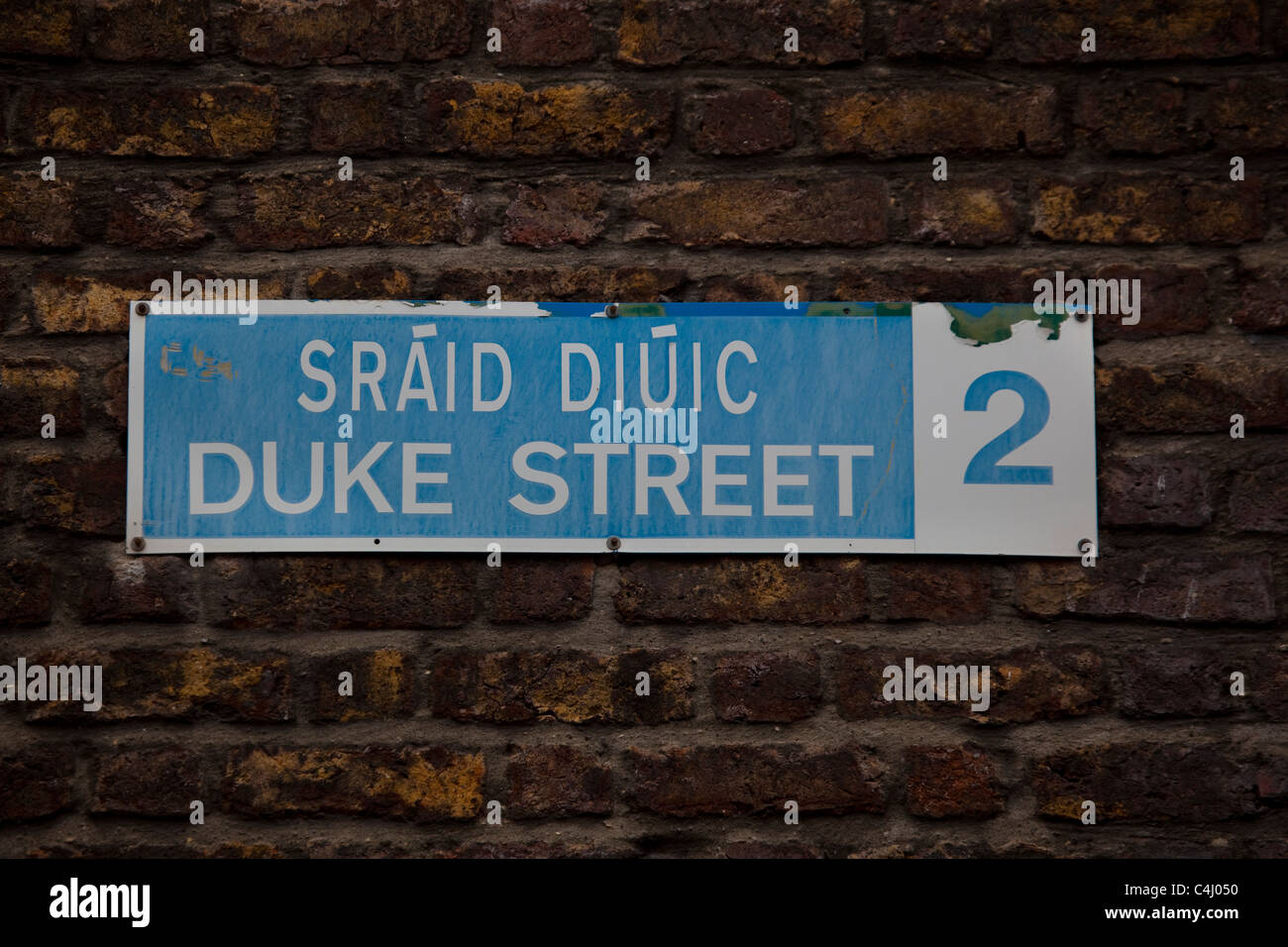 Official street sign for Duke St. on redbrick wall in Dublin city ...