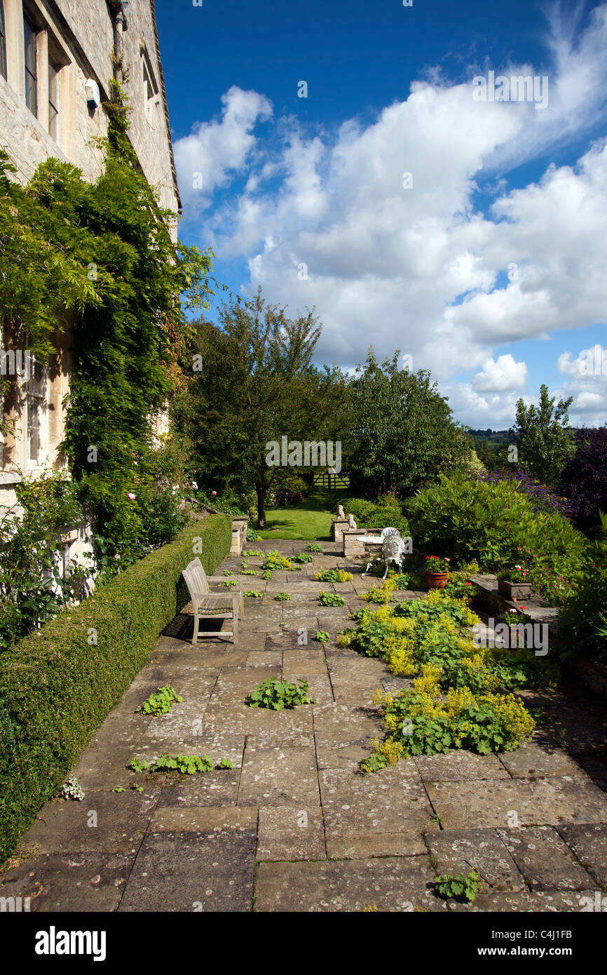 UK gardens. Mature flagstone slabbed garden terrace Stock Photo - Alamy