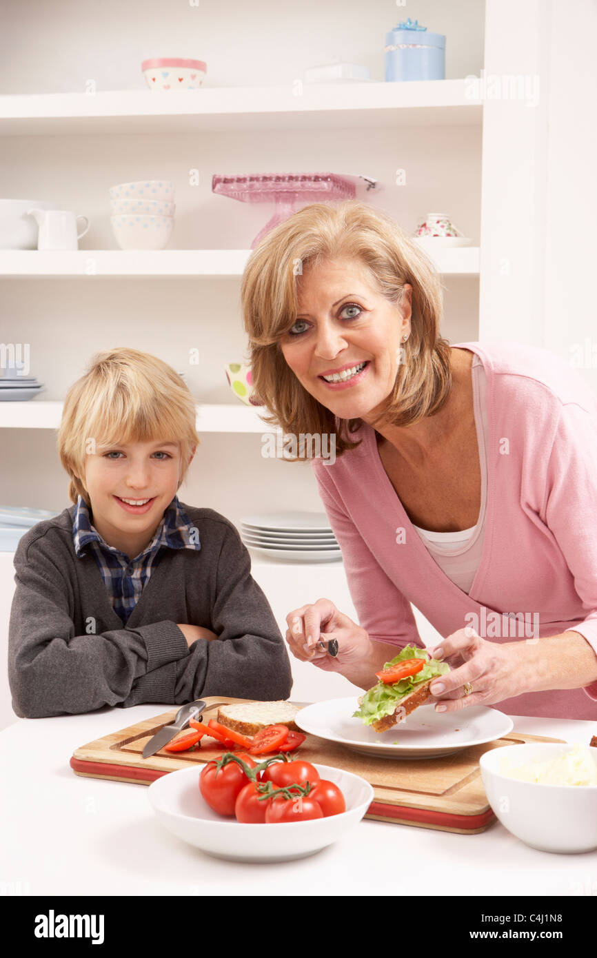 Grandmother And Grandson Making Sandwich In Kitchen Stock Photo - Alamy