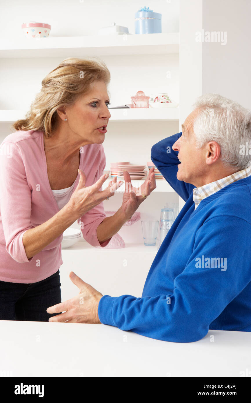 Mature couple having argument at home hi-res stock photography and ...