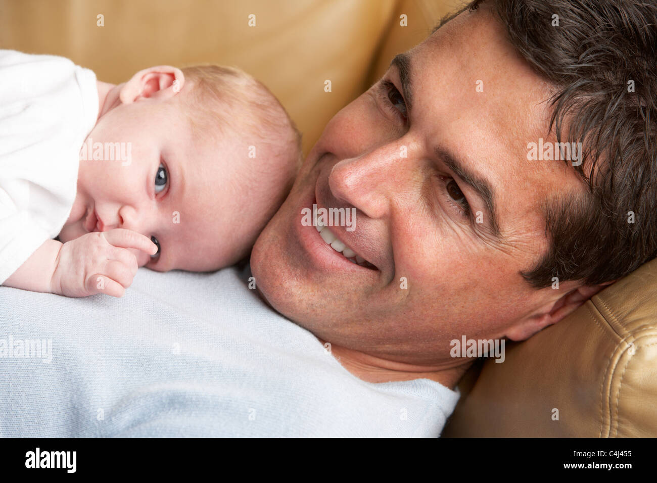 Portrait Of Father With Newborn Baby At Home Stock Photo - Alamy