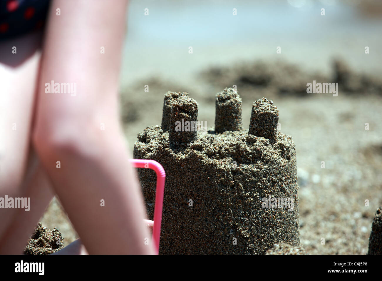 Child making sandcastles hi-res stock photography and images - Alamy