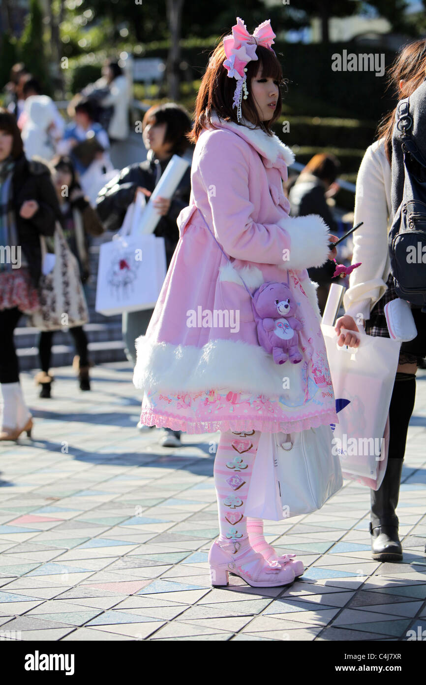 Teenage girl dressed all in pink, representing manga character. Tokyo ...