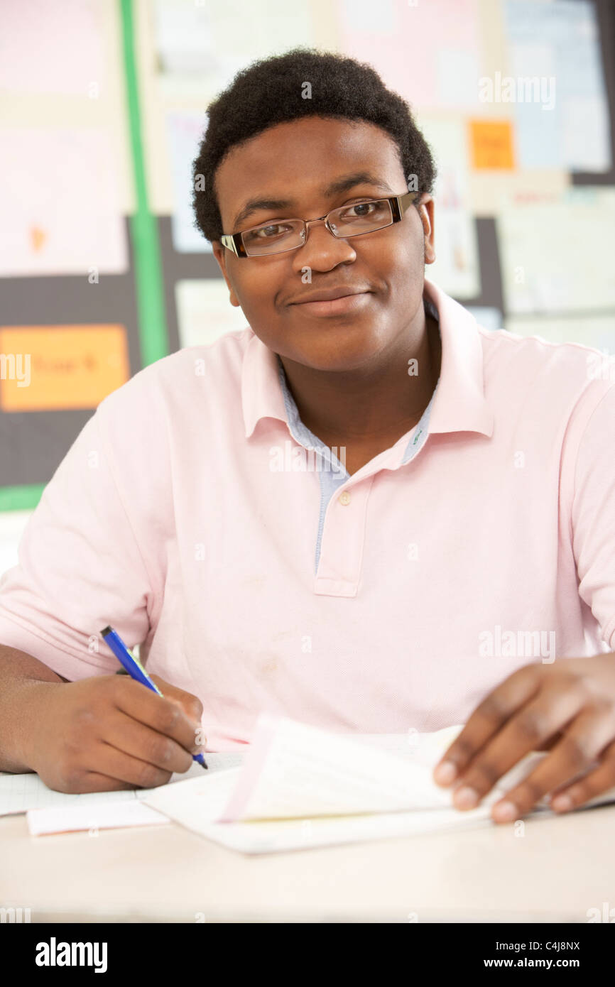 Male Teenage Student Studying In Classroom Stock Photo - Alamy