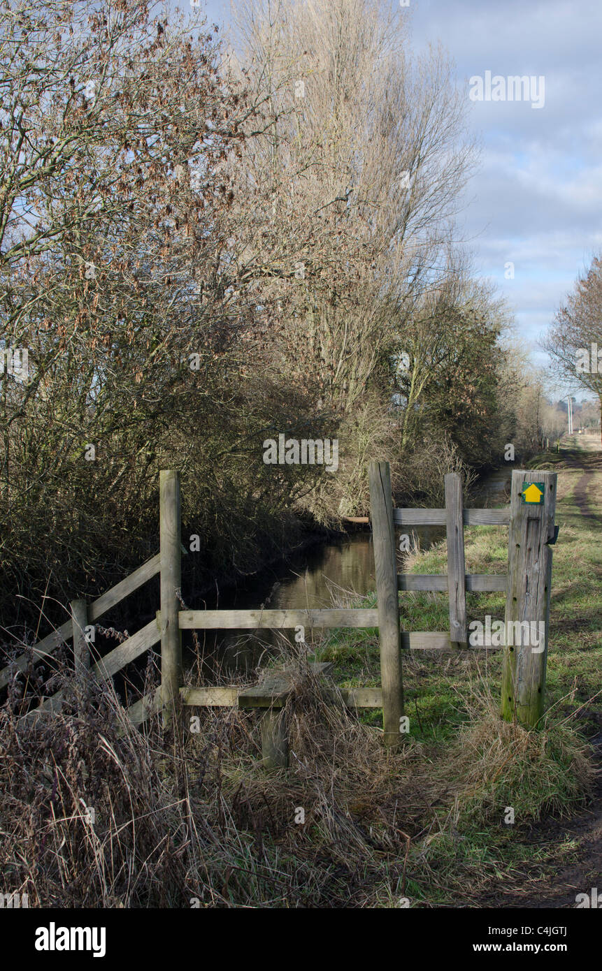 Stile and footpath beside Nafferton Beck, East Yorkshire, England, UK ...