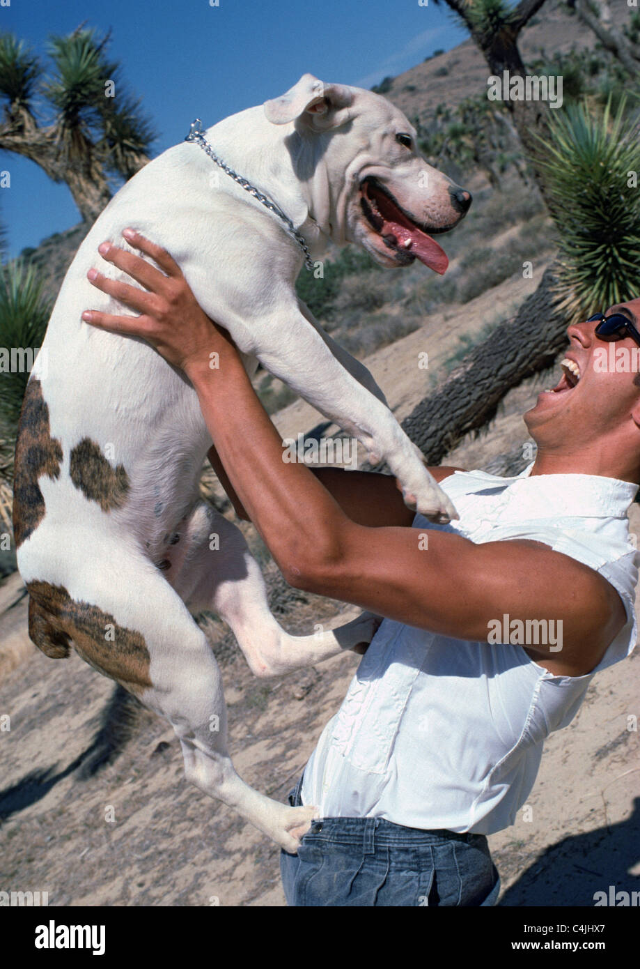 man playing with his dog Stock Photo - Alamy