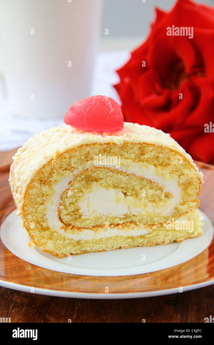 biscuit roulade with cream and white chocolate Stock Photo - Alamy