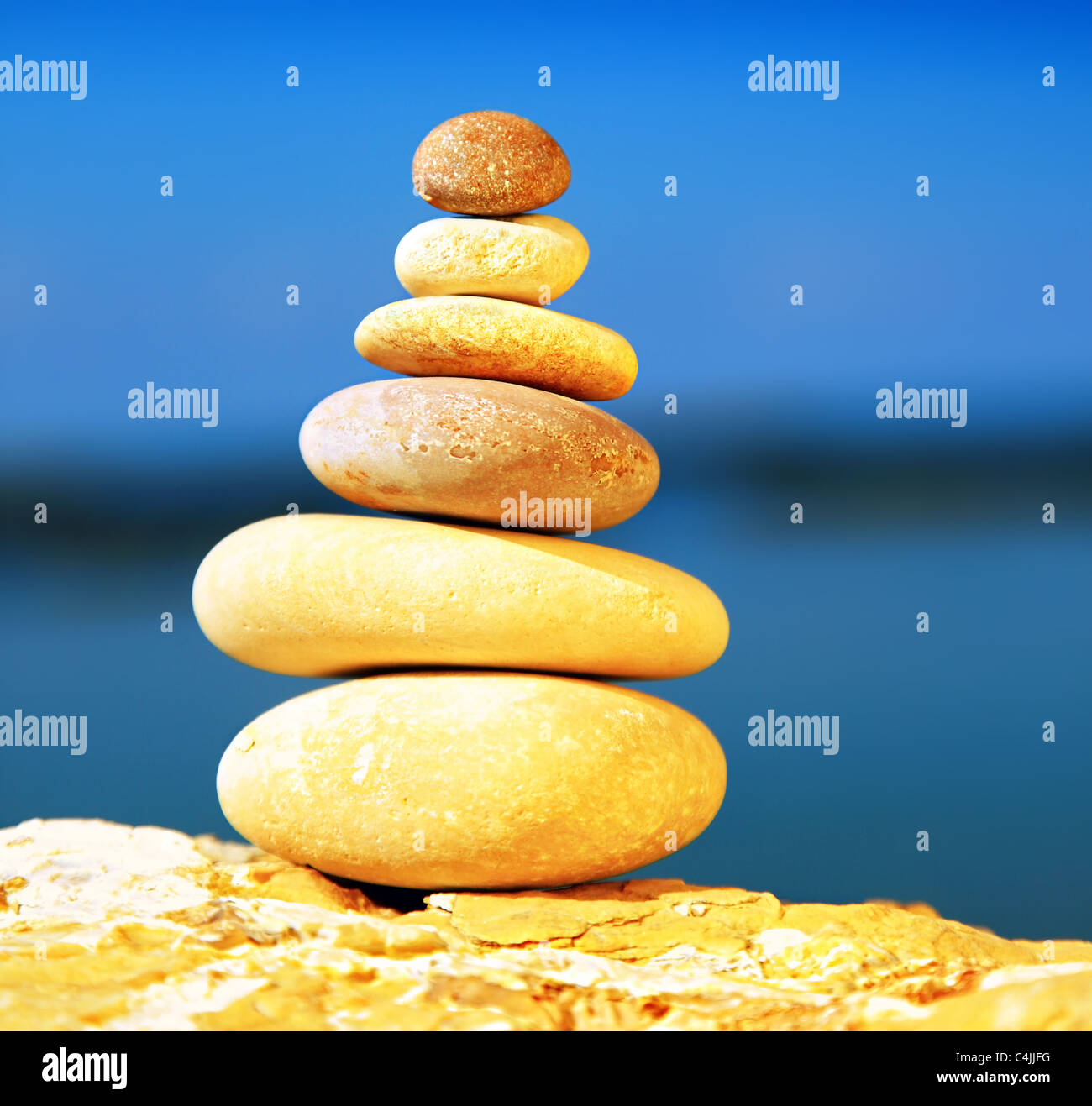 Zen spa balance stones, over blue calm sea background, conceptual image ...