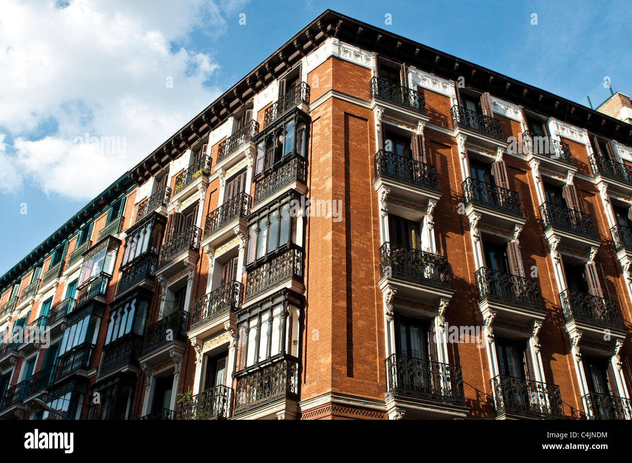 Brick house with iron balconies, Madrid, Spain Stock Photo - Alamy