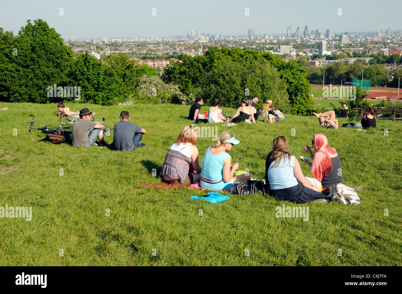 UK. People enjoy views of London from Parliament Hill on Hampstead ...