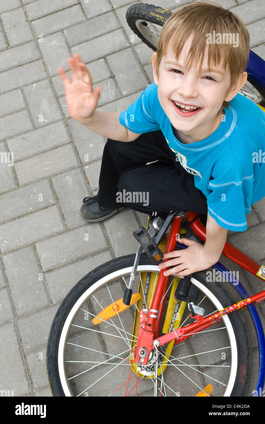 Boy and bicycle Stock Photo - Alamy