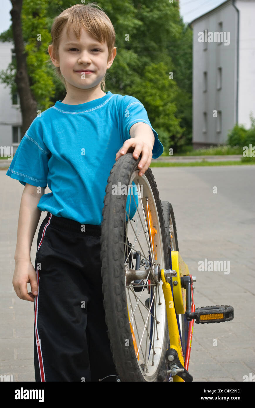 Boy and bicycle Stock Photo - Alamy