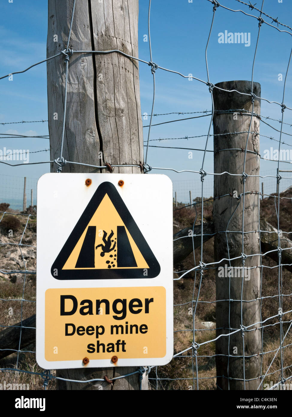 Warning sign above old mine shaft Stock Photo - Alamy Warning sign above old mine shaft Stock Photo - Alamy
