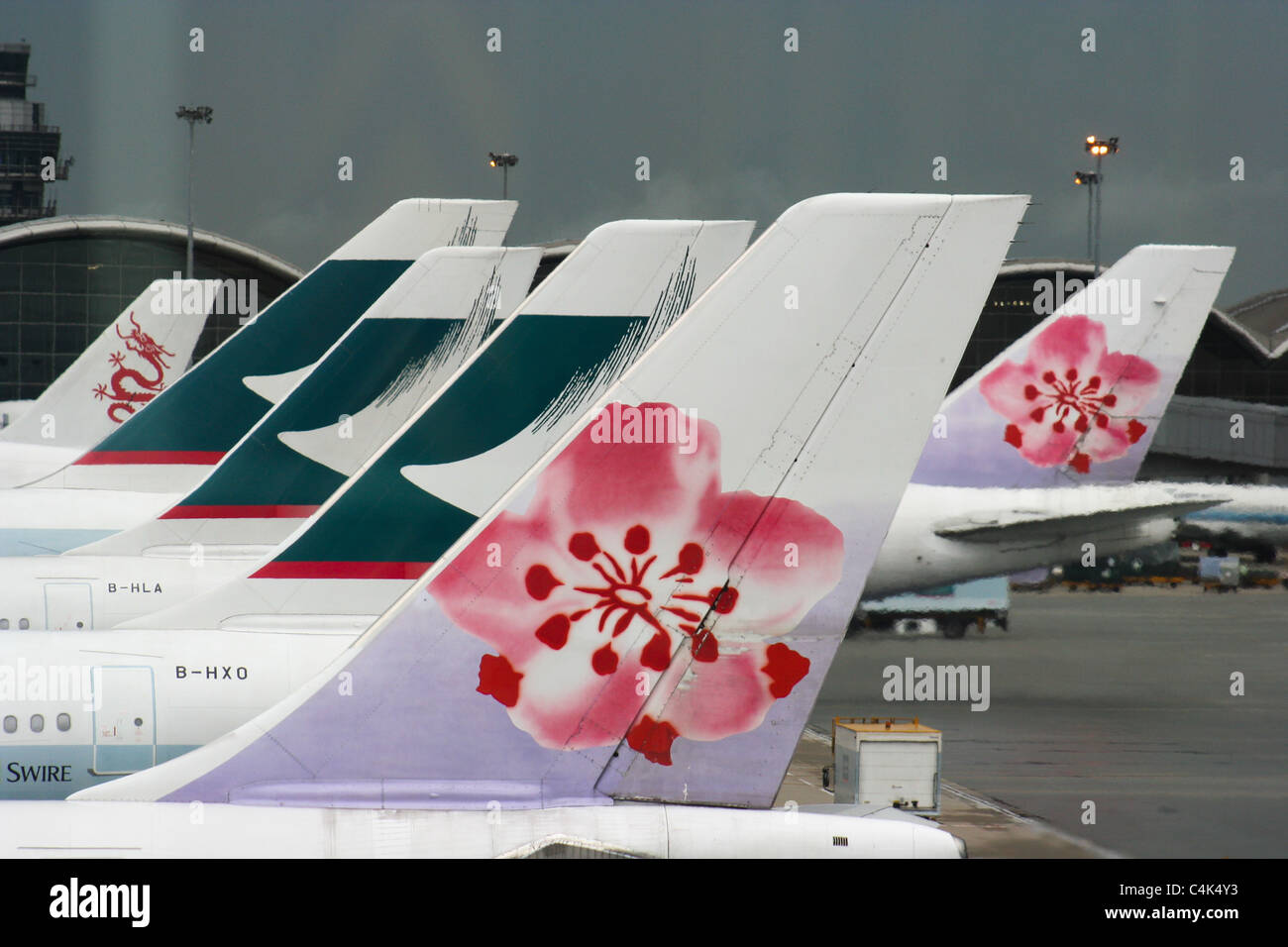 Cathay Pacific china airlines tailfins tails plane Stock Photo - Alamy