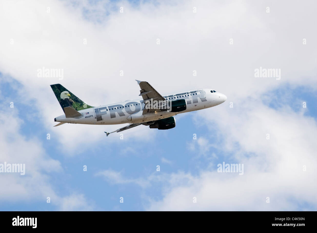 Denver, Colorado - A Frontier Airlines passenger jet departs Denver ...