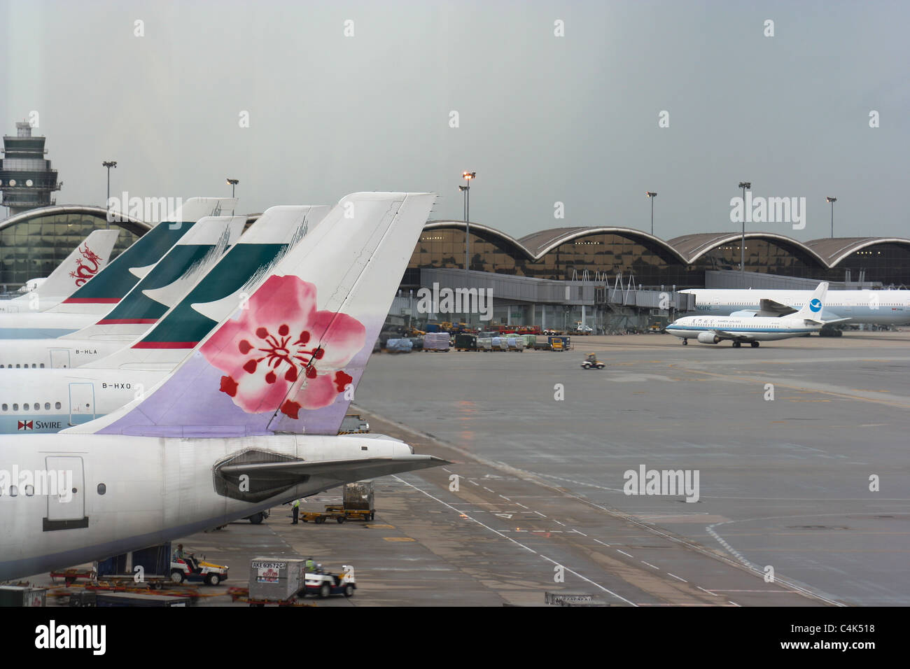 Cathay Pacific china airlines tailfins tails plane Stock Photo - Alamy