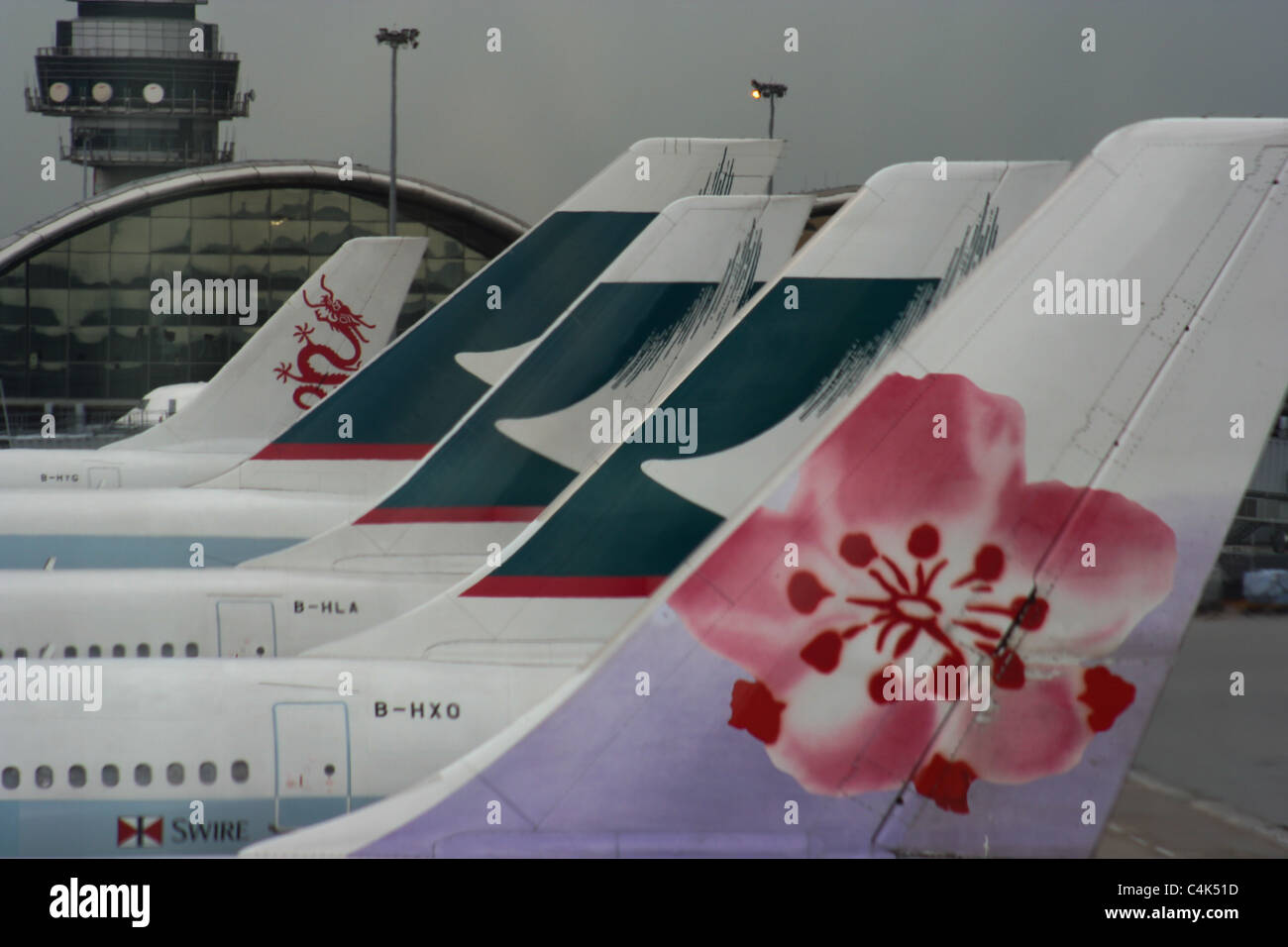 Cathay Pacific china airlines tailfins tails plane Stock Photo - Alamy