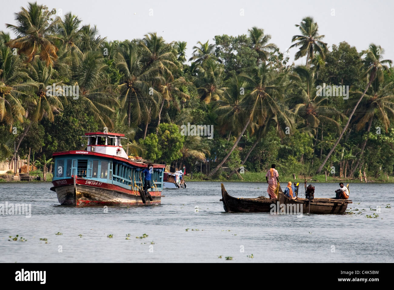 Ferry & canoes in the backwaters of Alleppey (Alappuzha), Kerala, India ...