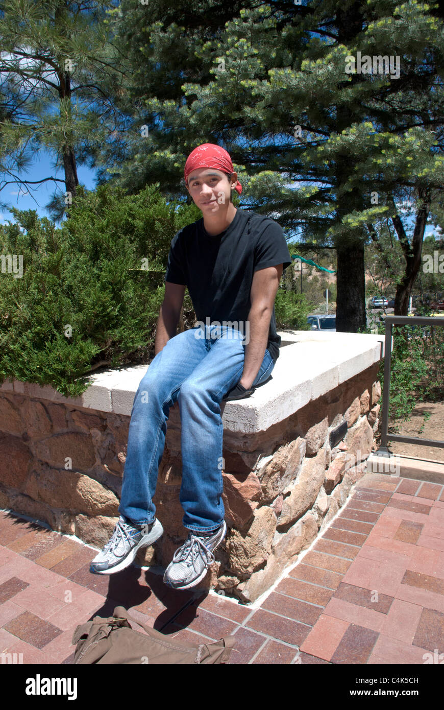 An underclassman sits watching festivities after the graduation ...