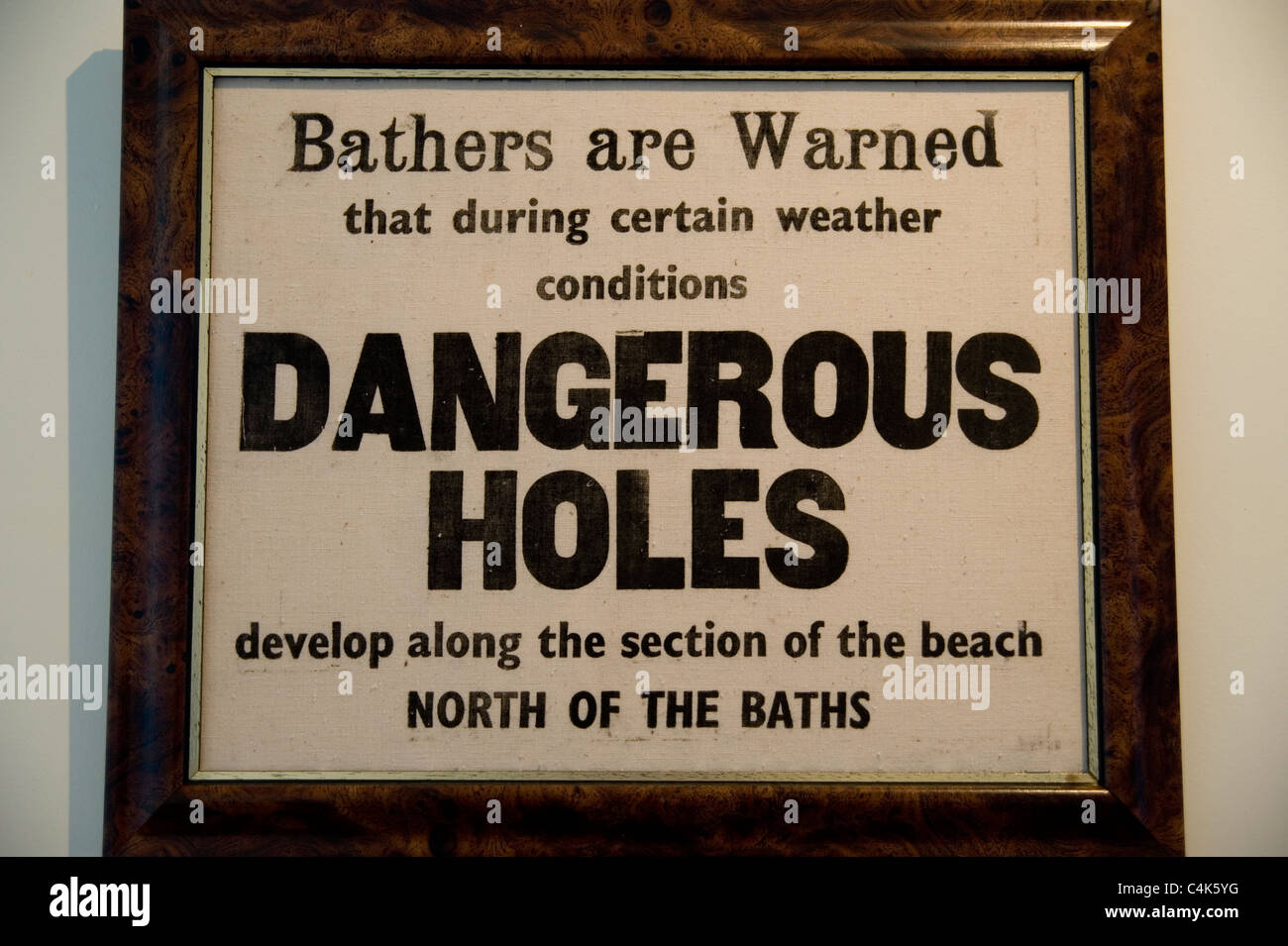 old warning sign for bathers Stock Photo - Alamy