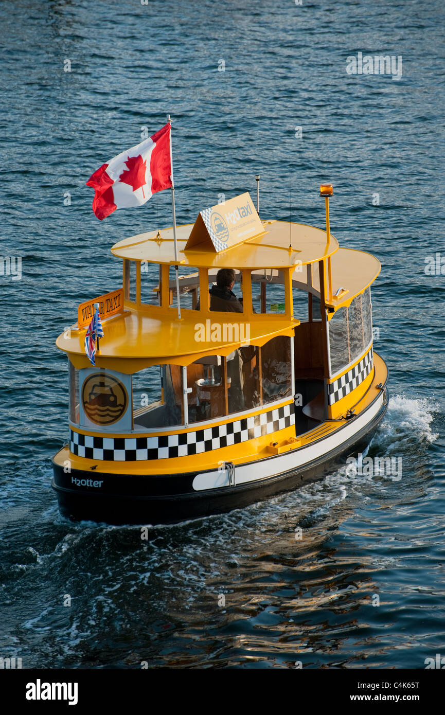 Water taxis run around the Inner Harbor of Victoria, British Columbia ...